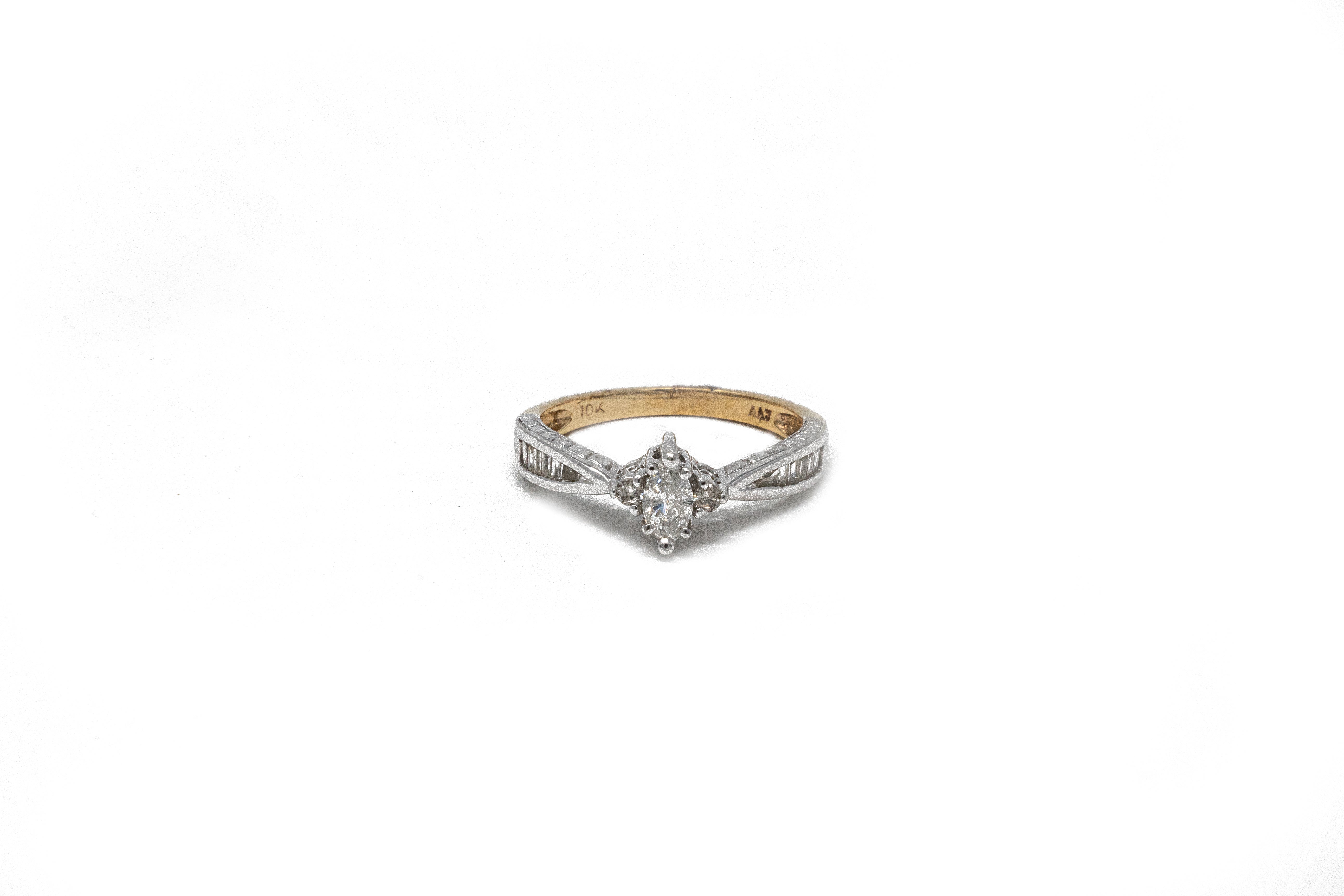 .30 point Marquise Cut and .24 point Tapered Baguettes Cut Diamond Rin