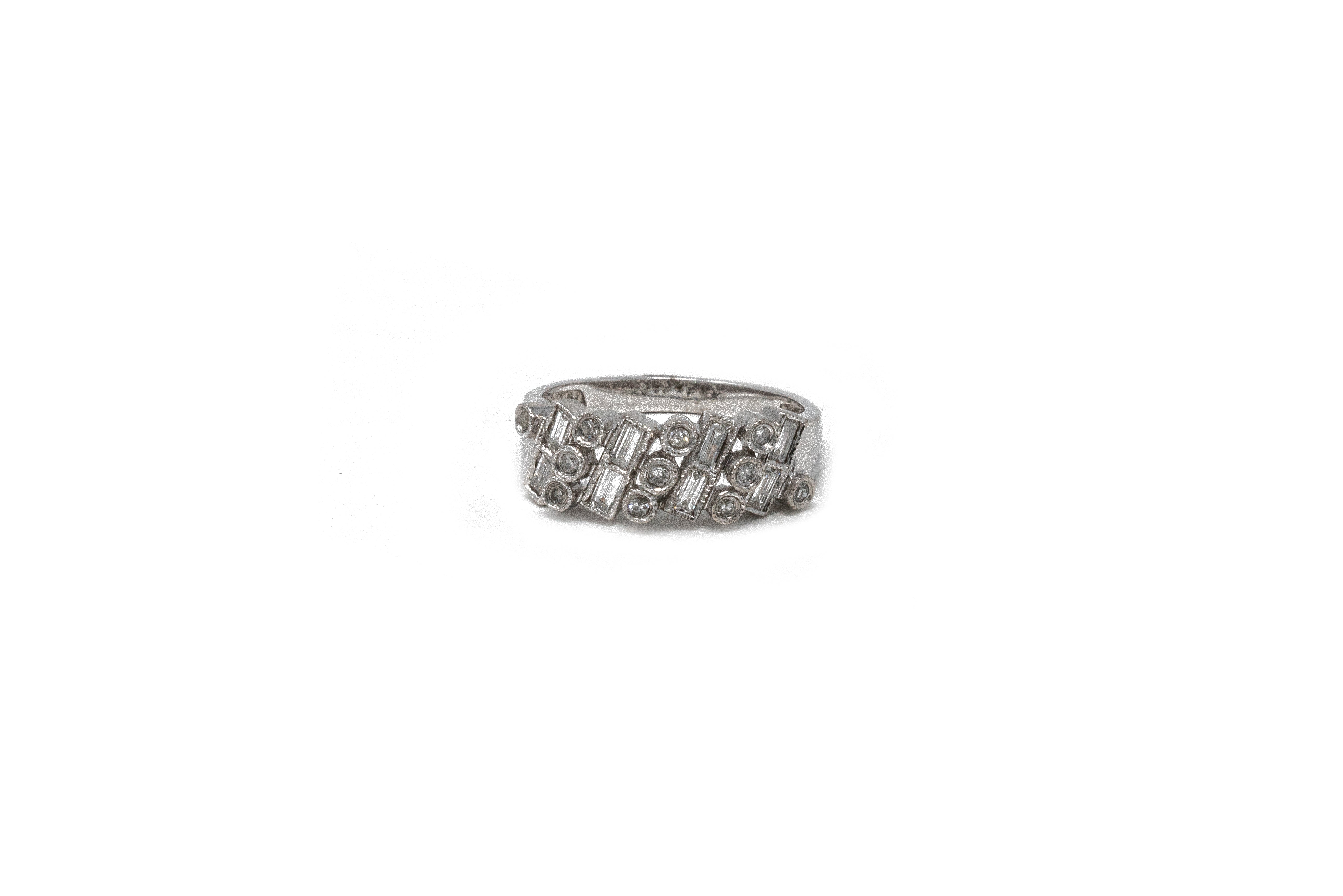 .40 point Baguette Cut and .10 point Round Single Cut Diamond Ring